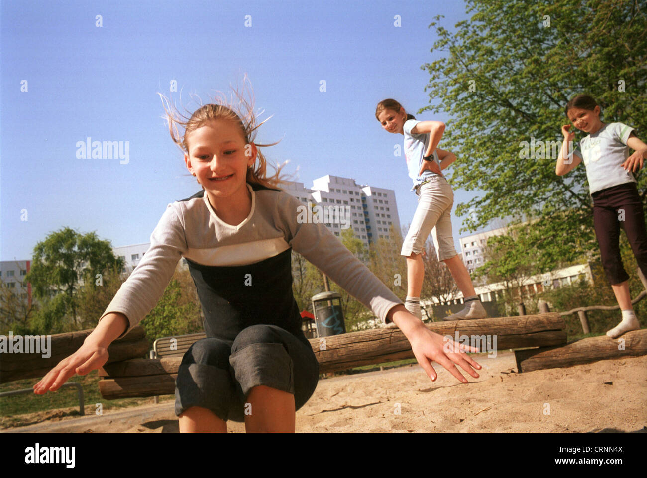 Girl romp in a playground in Berlin Stock Photo - Alamy