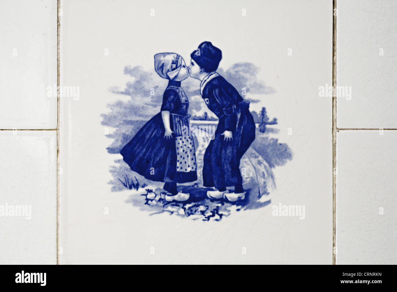 Boy and girl kissing, antique frisian tile Stock Photo - Alamy