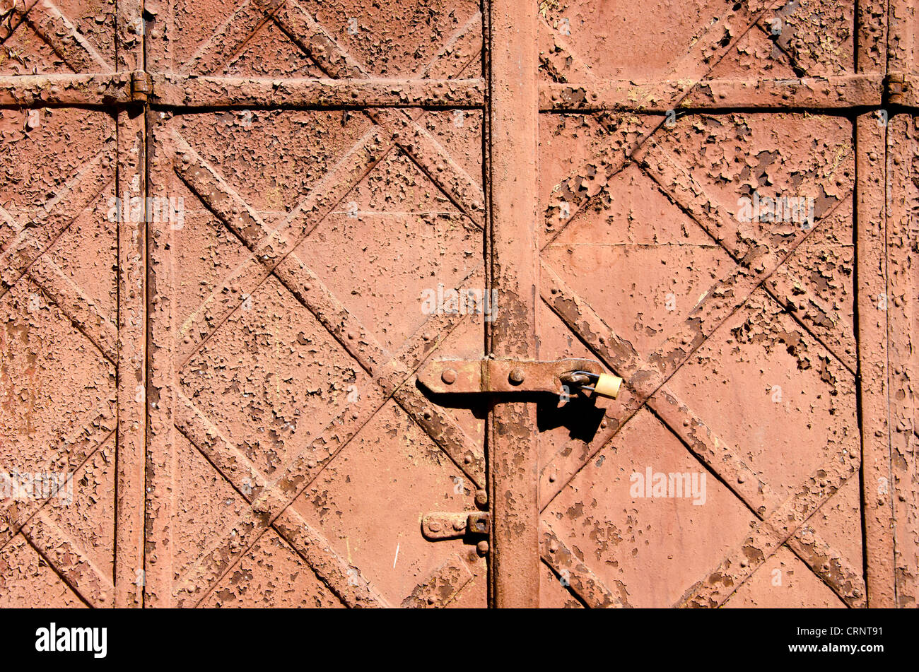 ancient metal door with new lock fragment Stock Photo - Alamy
