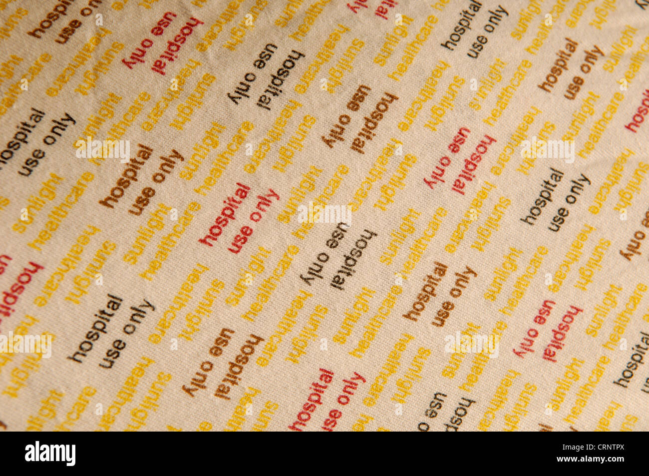 A close up view of a hospital gown stamped with the words hospital use ...