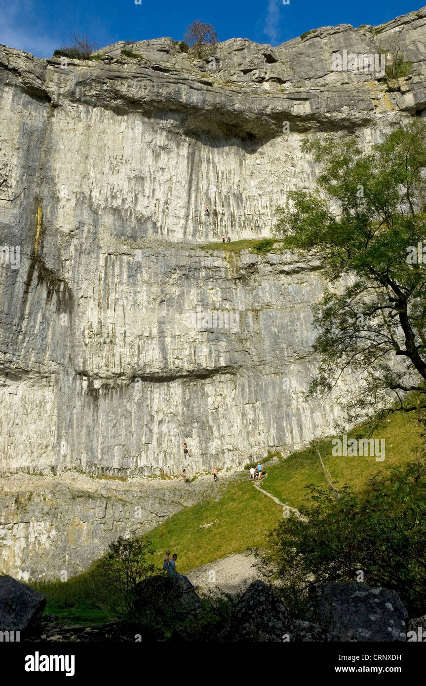 People rock climbing on Malham Cove, a spectacular limestone crag ...