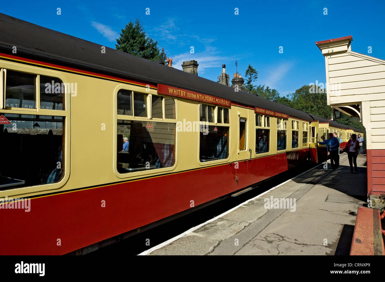 Passengers boarding a train carriage at Goathland Station on the North ...