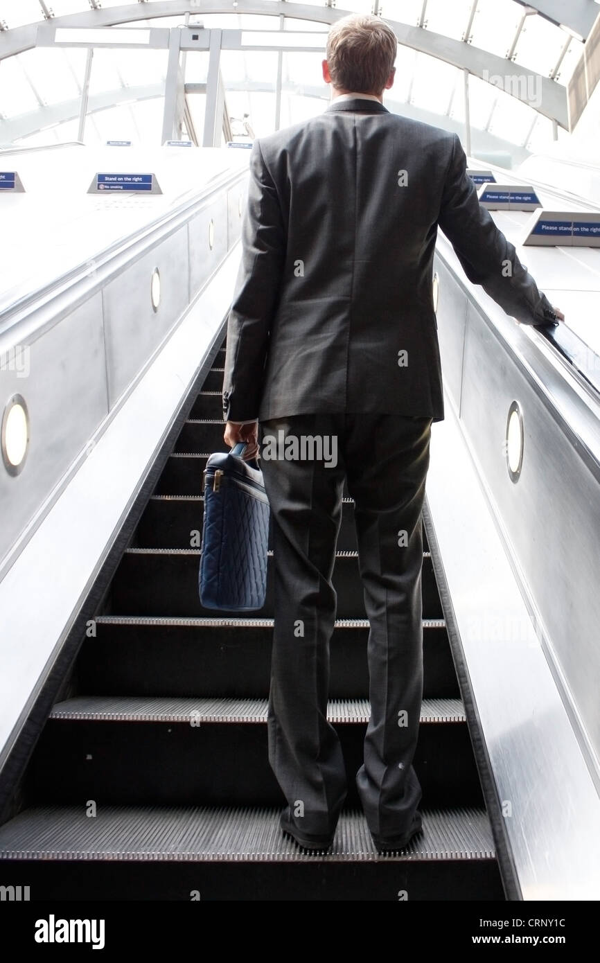 A business man commuting in suit Stock Photo - Alamy