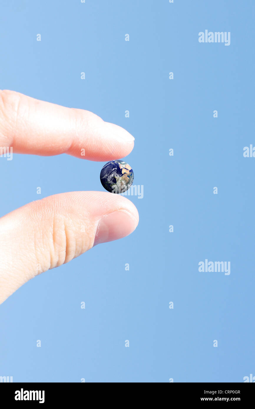 The world between your fingers Stock Photo - Alamy
