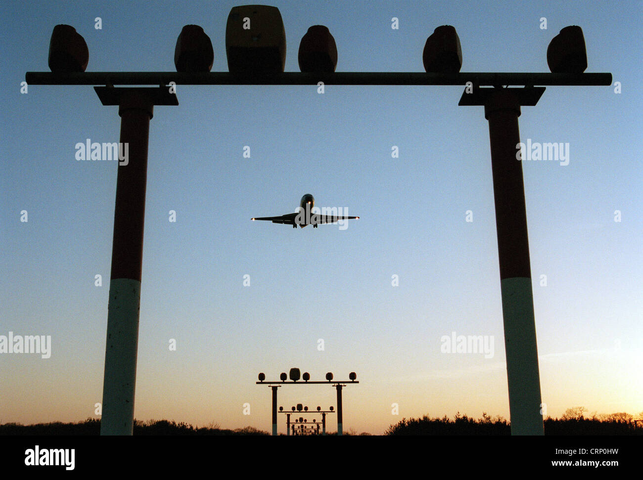 Approach lights and airplane landing at night Stock Photo - Alamy