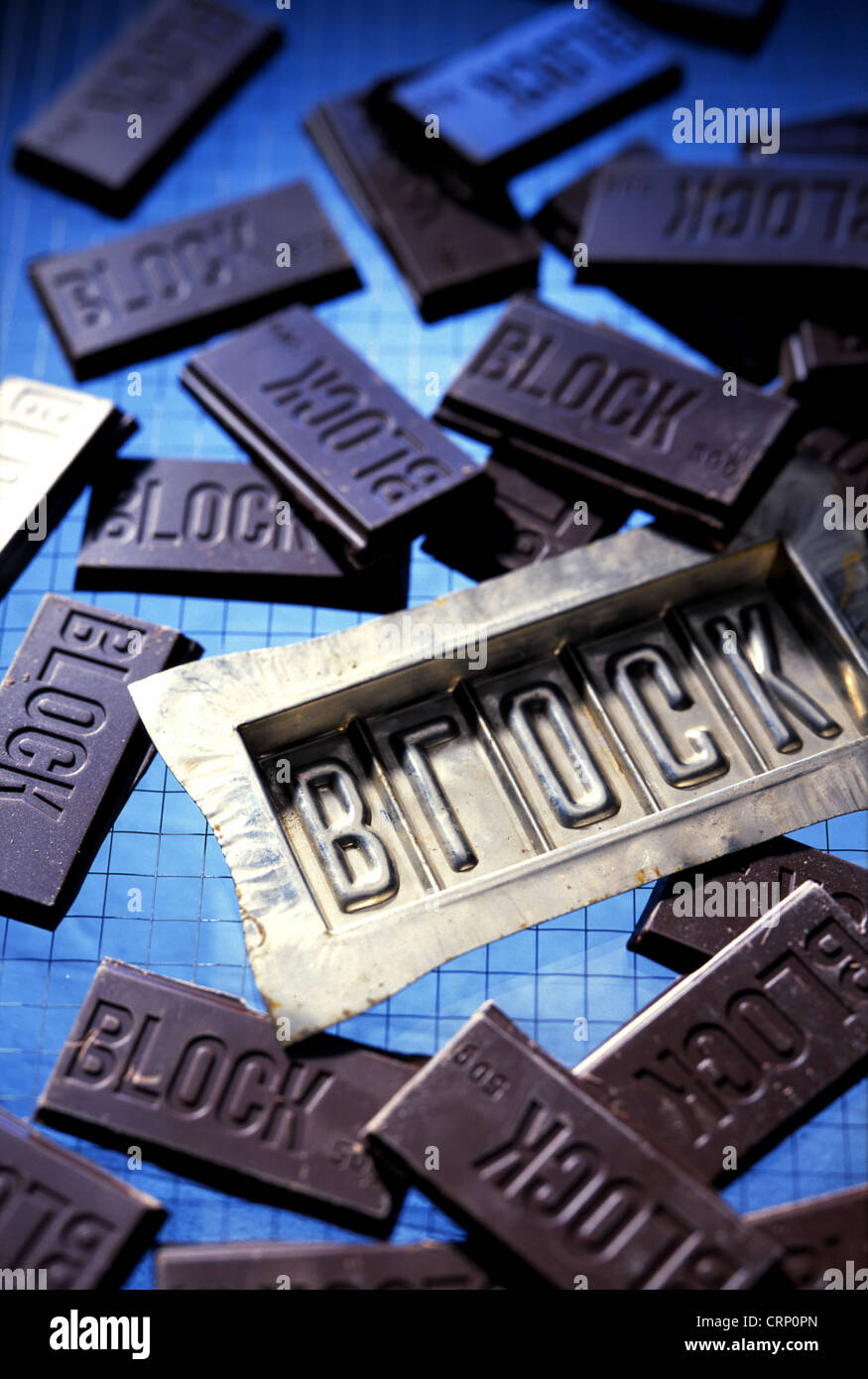Chocolate block with associated shape Stock Photo - Alamy