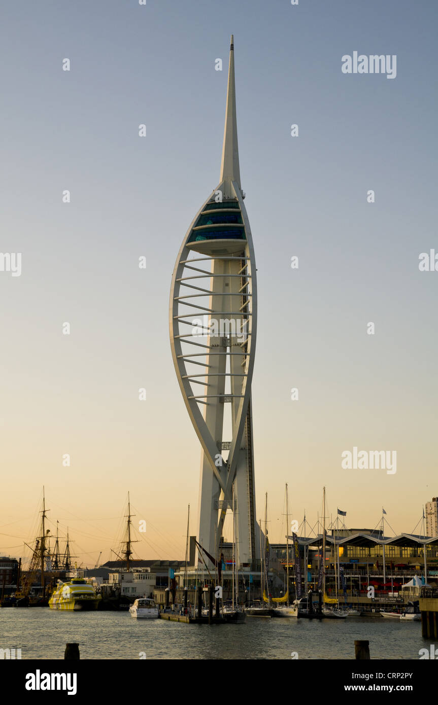 View of harbour and waterfront with Spinnaker Tower in evening light ...