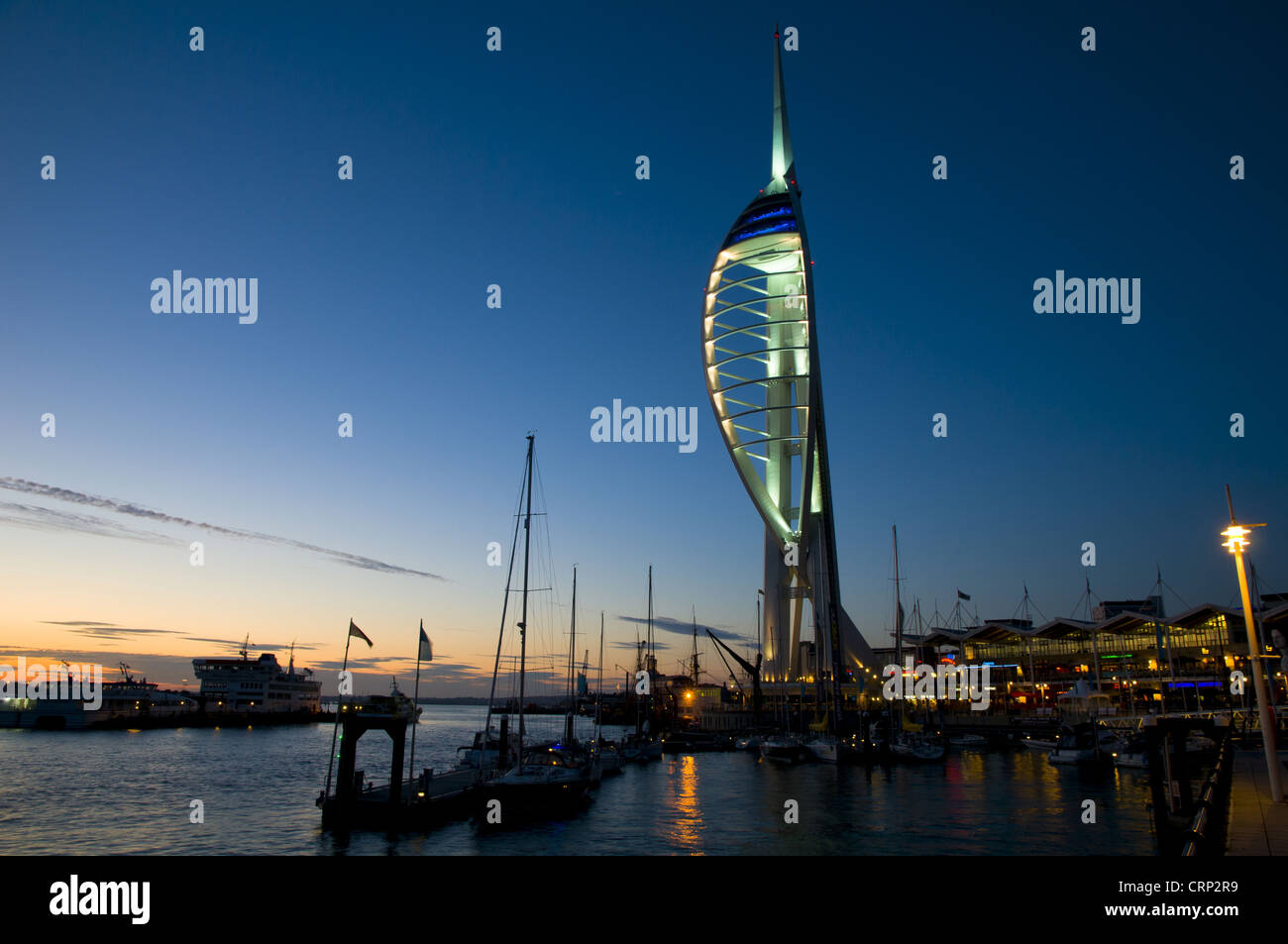 View of harbour and waterfront with Spinnaker Tower illuminated after ...