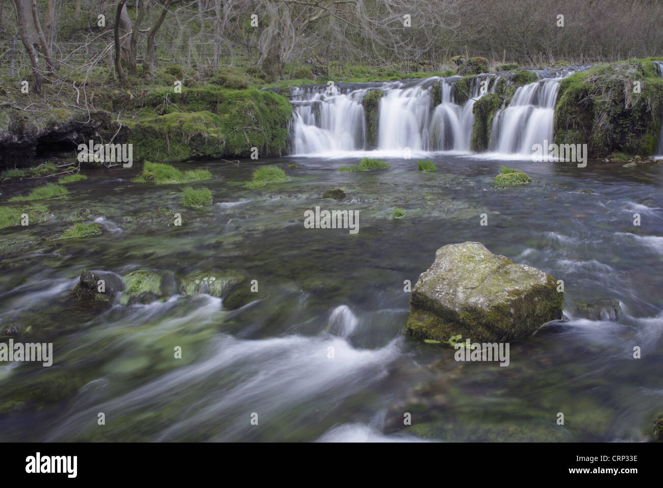 View of waterfall and rock in river, River Lathkill, Lathkill Dale ...