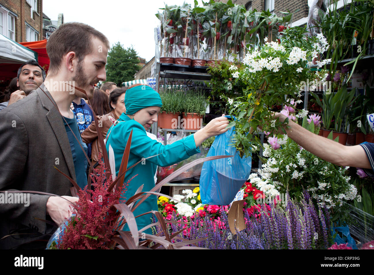 Buyers and sellers at East London's famous Sunday flower market on ...