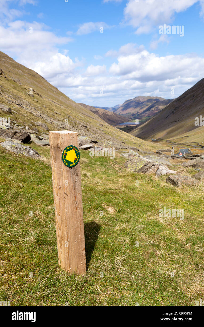 A public footpath waymark in the Kirkstone Pass, Cumbria looking down ...