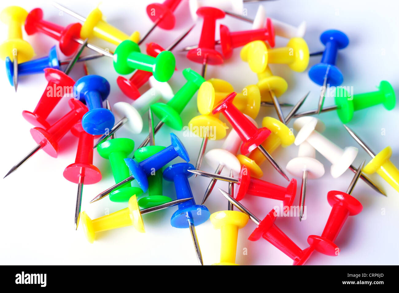 Office clips on paper isolated on a white Stock Photo - Alamy