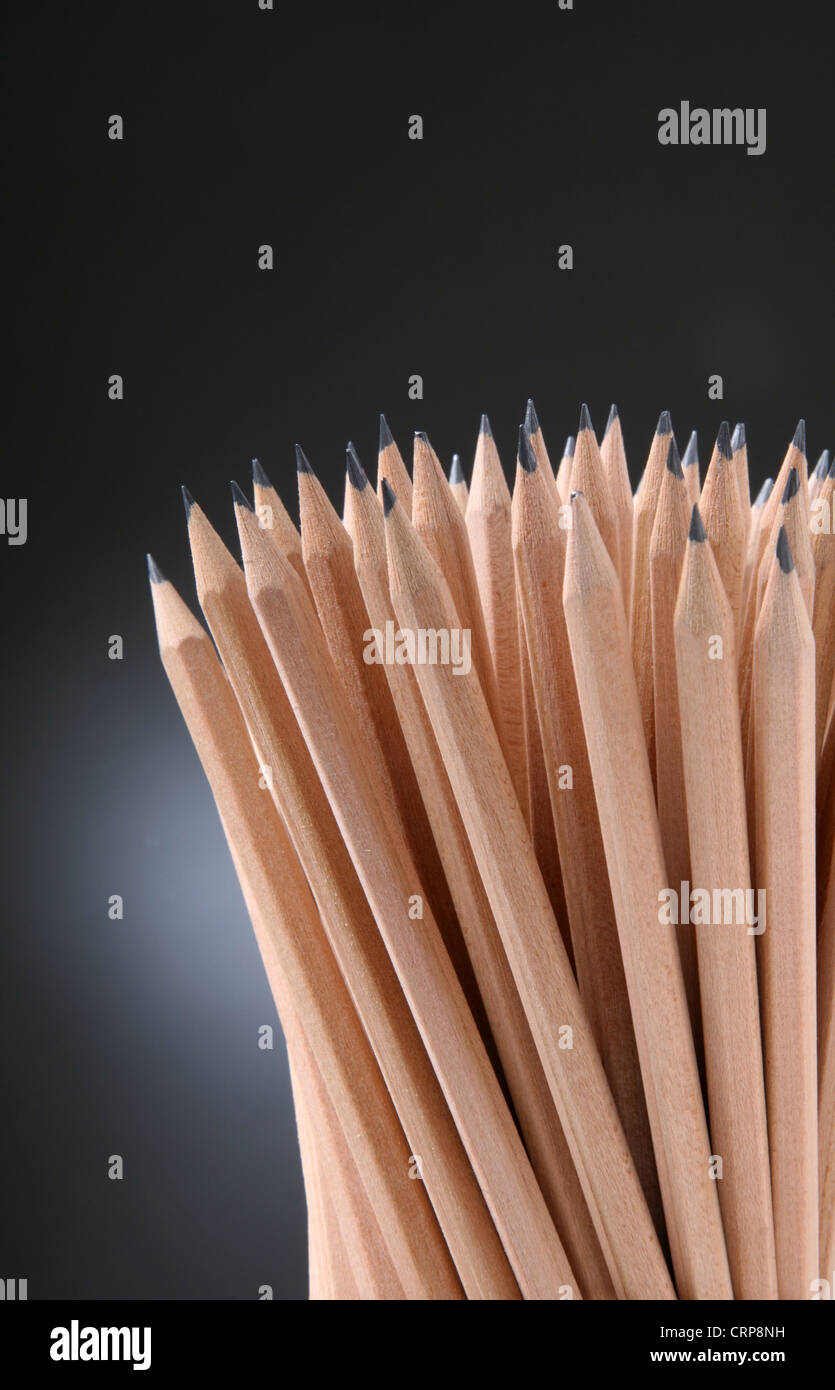 Bunch of pencils isolated on black Stock Photo - Alamy
