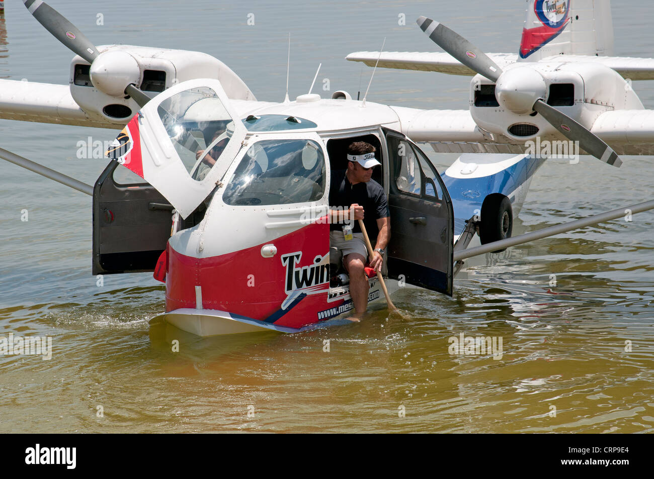 Paddling to deeper water pilot & student of a Twin Bee seaplane paddle ...