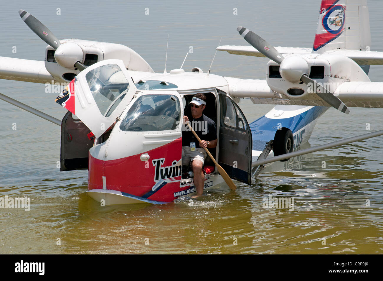 Paddling to deeper water pilot & student of a Twin Bee seaplane paddle ...