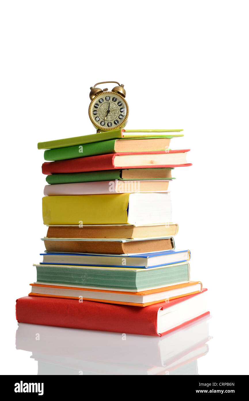 stack of books with vintage clock, isolated on white background Stock ...