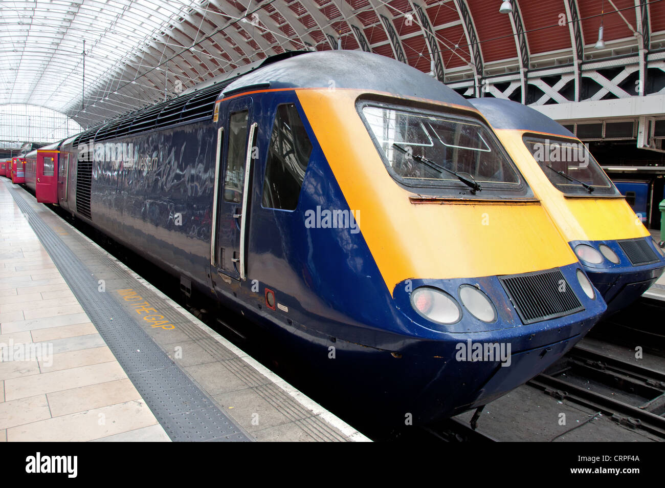 Two trains at a railway station Stock Photo - Alamy
