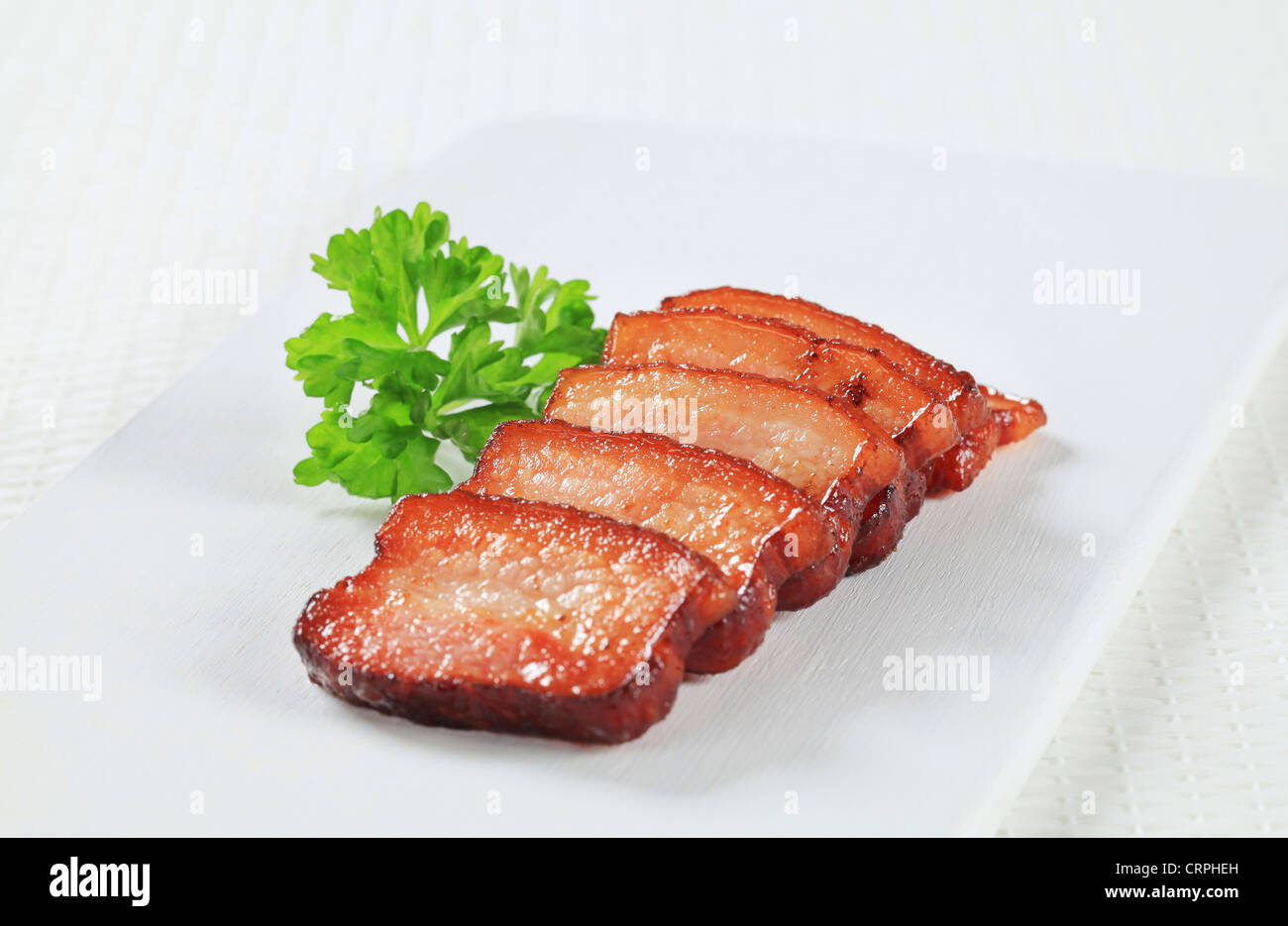 Pan fried pieces of salt pork Stock Photo - Alamy