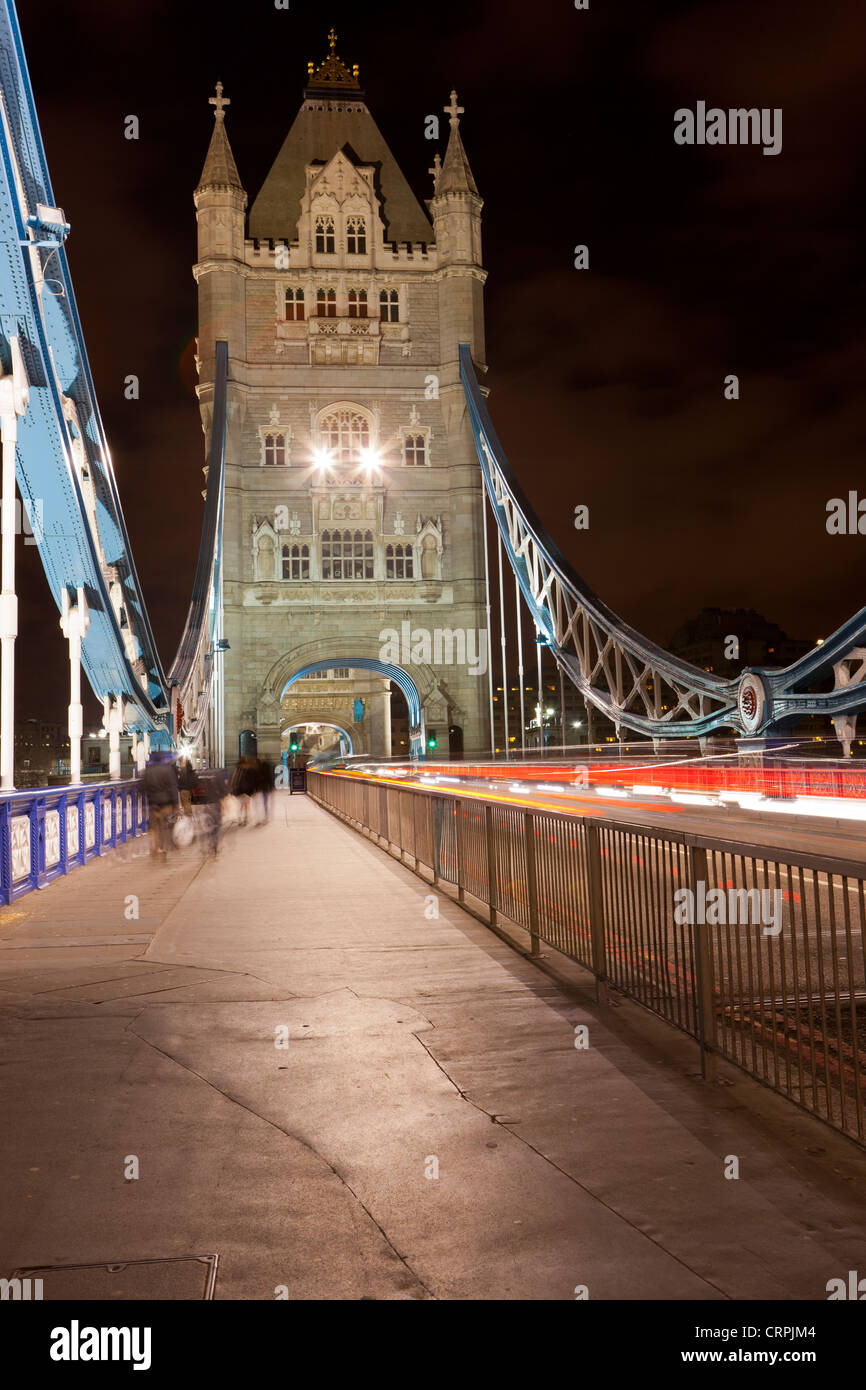 People and traffic crossing Tower Bridge at night Stock Photo - Alamy