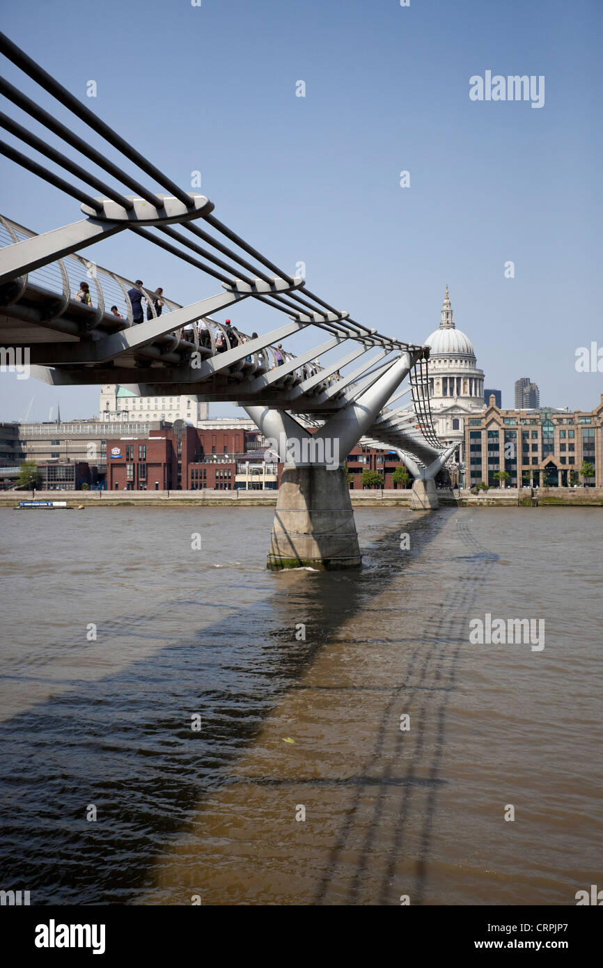 The Millennium footbridge with St. Paul's Cathedral's dome in the ...