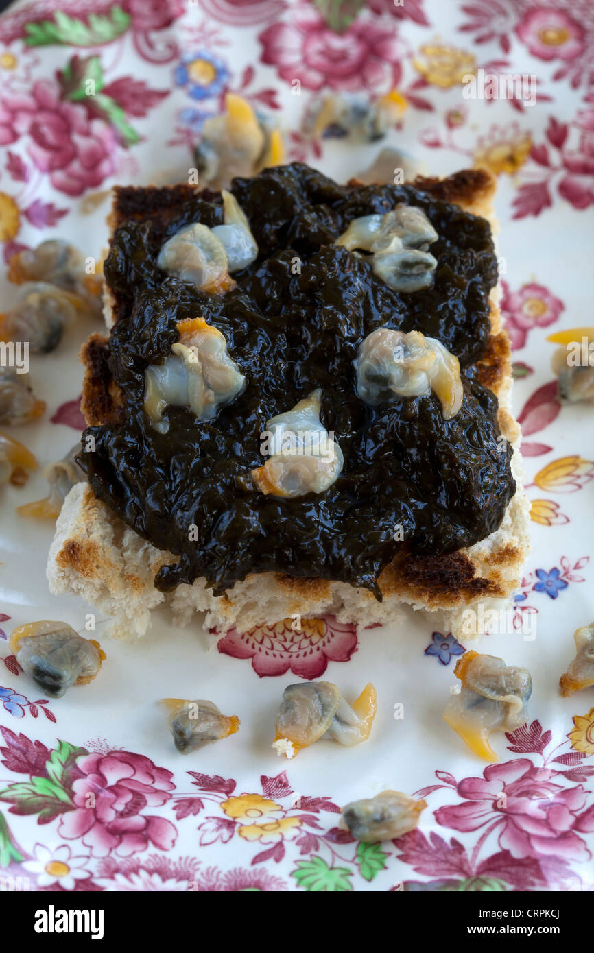 Laver Bread with Cockles on Toast - a Welsh Breakfast Delicacy Stock ...