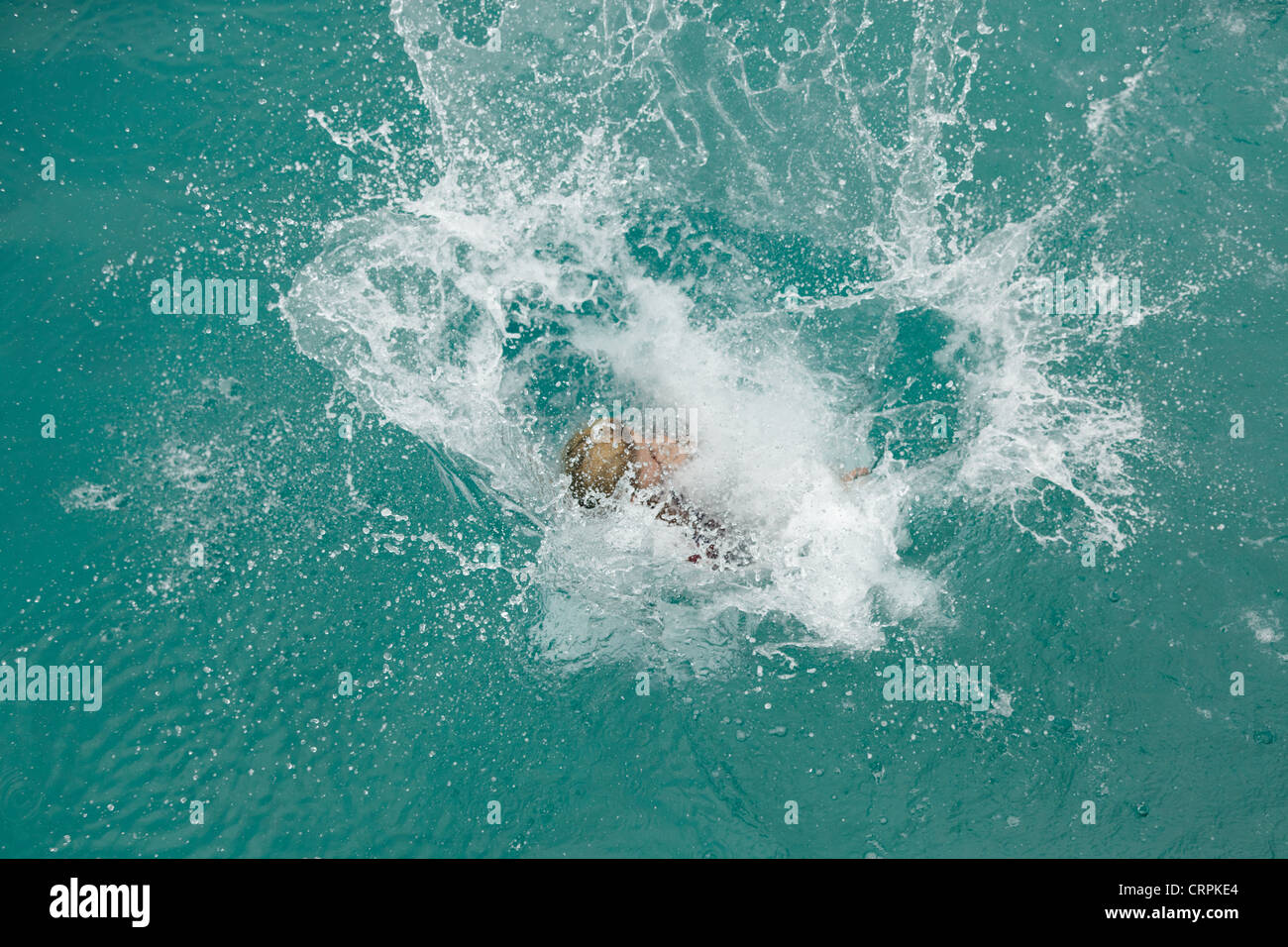 people jump and splashing in tropical sea Stock Photo - Alamy