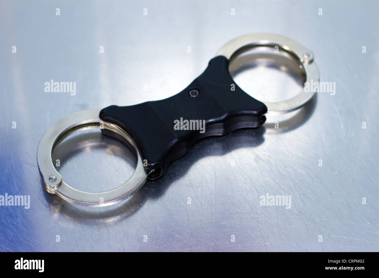 Jail cuffs hi-res stock photography and images - Alamy