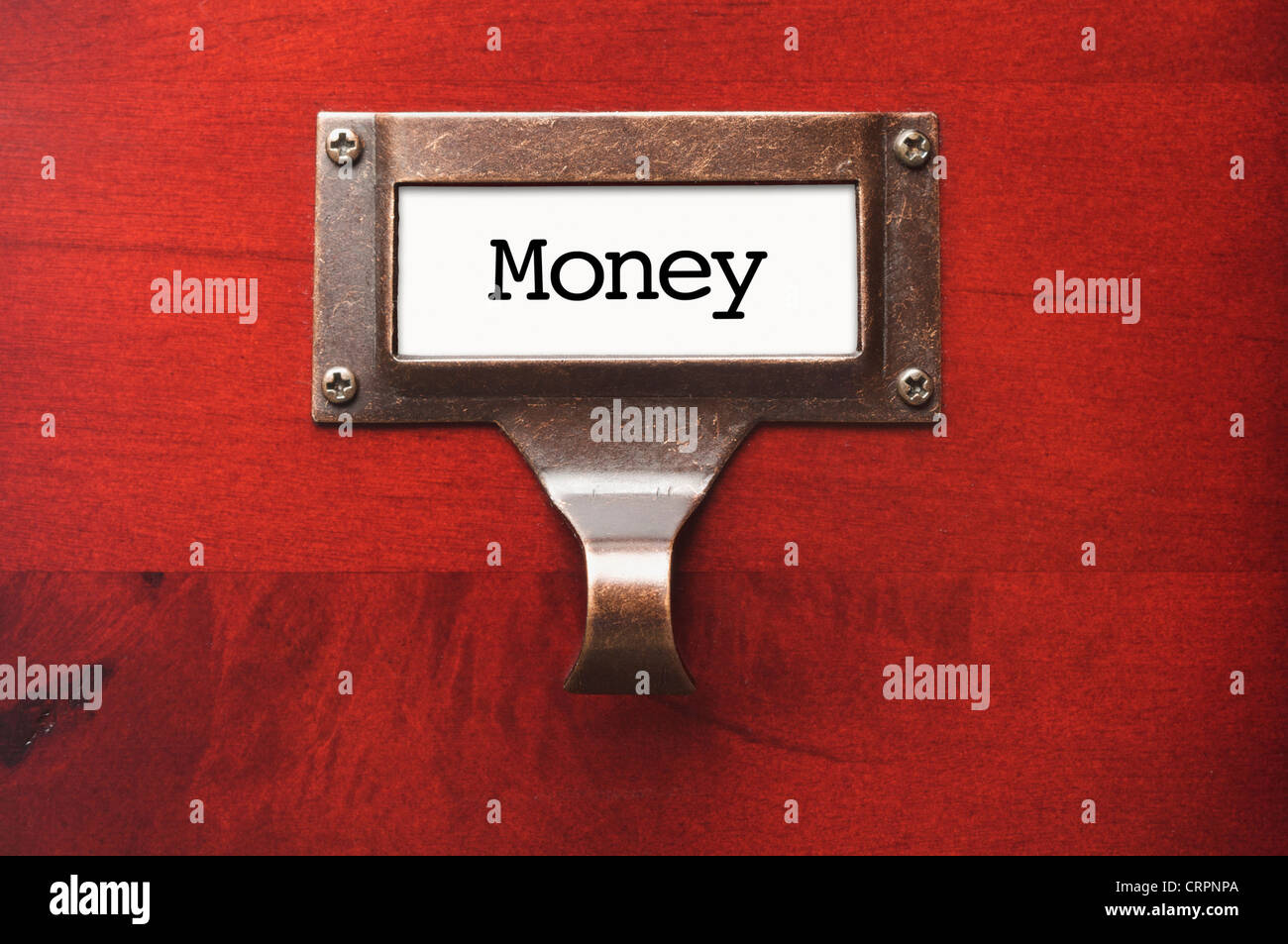 Lustrous Wooden Cabinet with Money File Label in Dramatic LIght Stock ...
