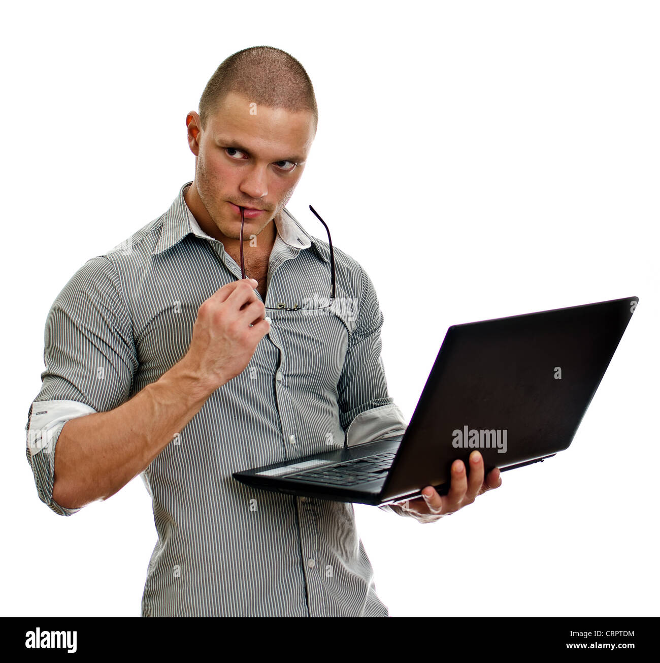 Young man with laptop thinking. Isolated on white background Stock ...