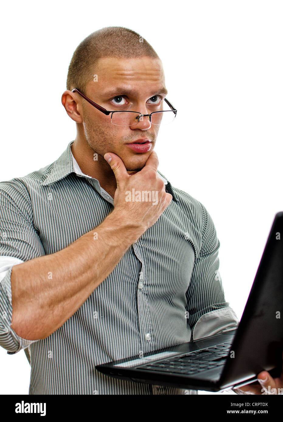 Young man with laptop thinking. Isolated on white background Stock ...