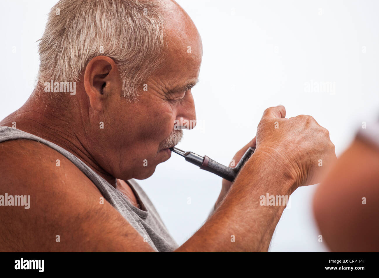 A Spanish man lighting his pipe Stock Photo - Alamy