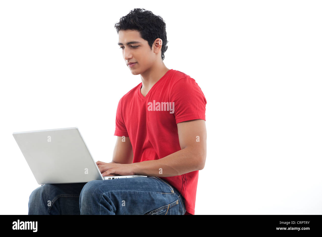 Young man using laptop over white background Stock Photo - Alamy