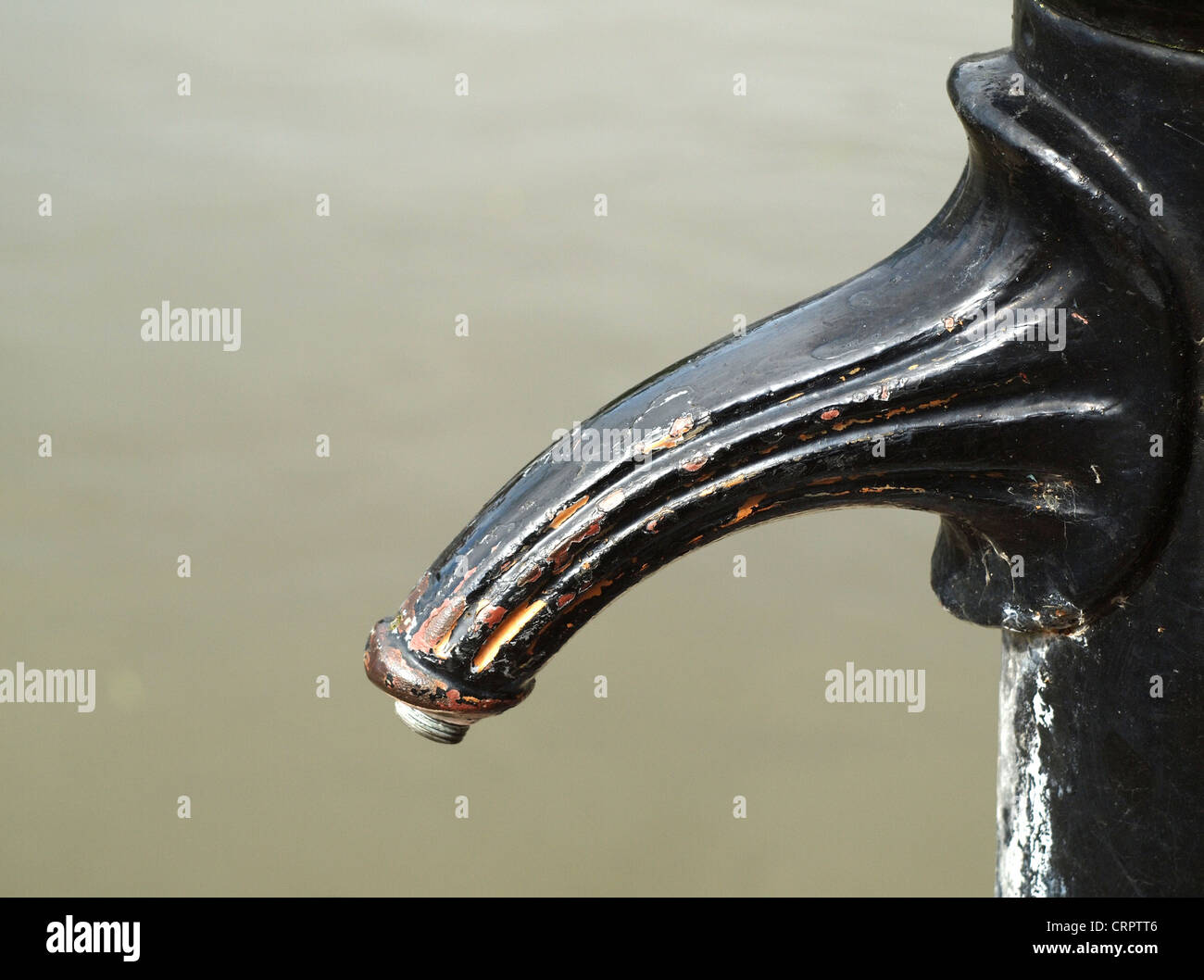 Spout of water pump by river Stock Photo - Alamy