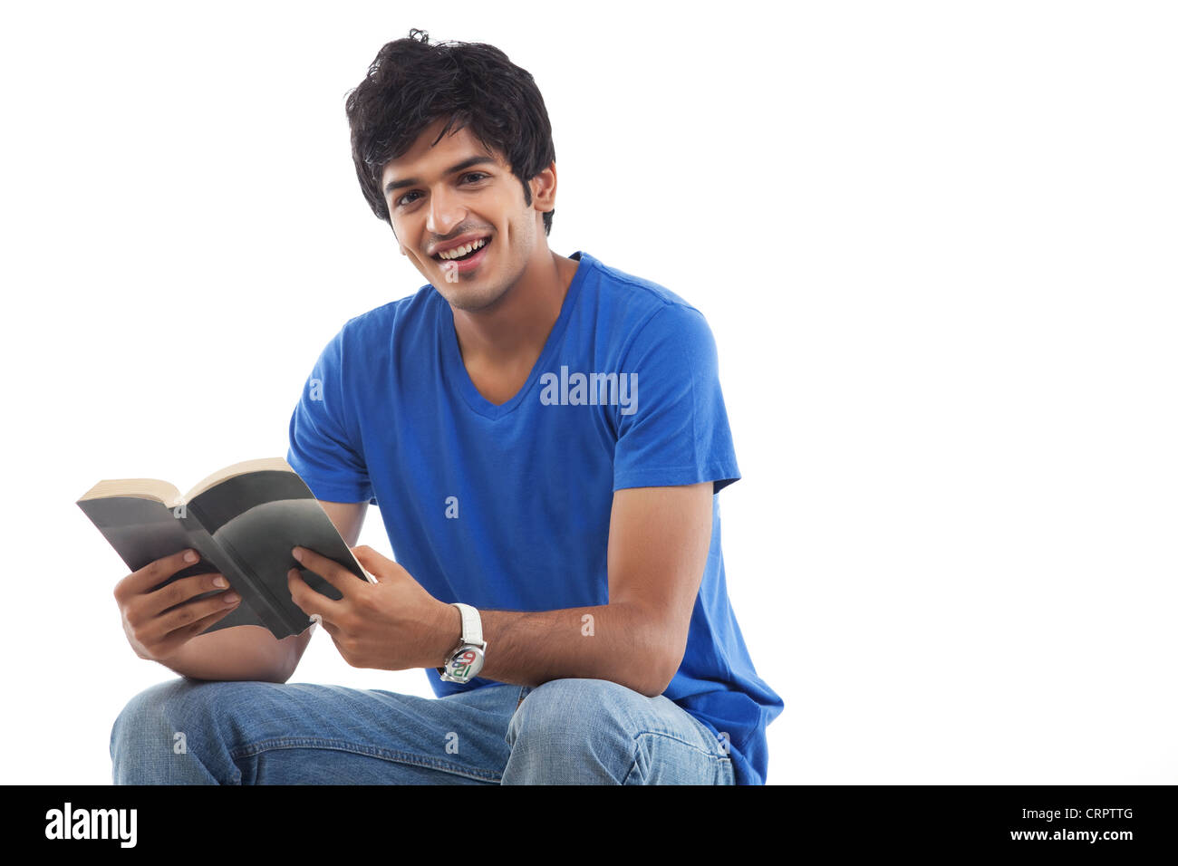 Portrait of young man with book against white background Stock Photo ...