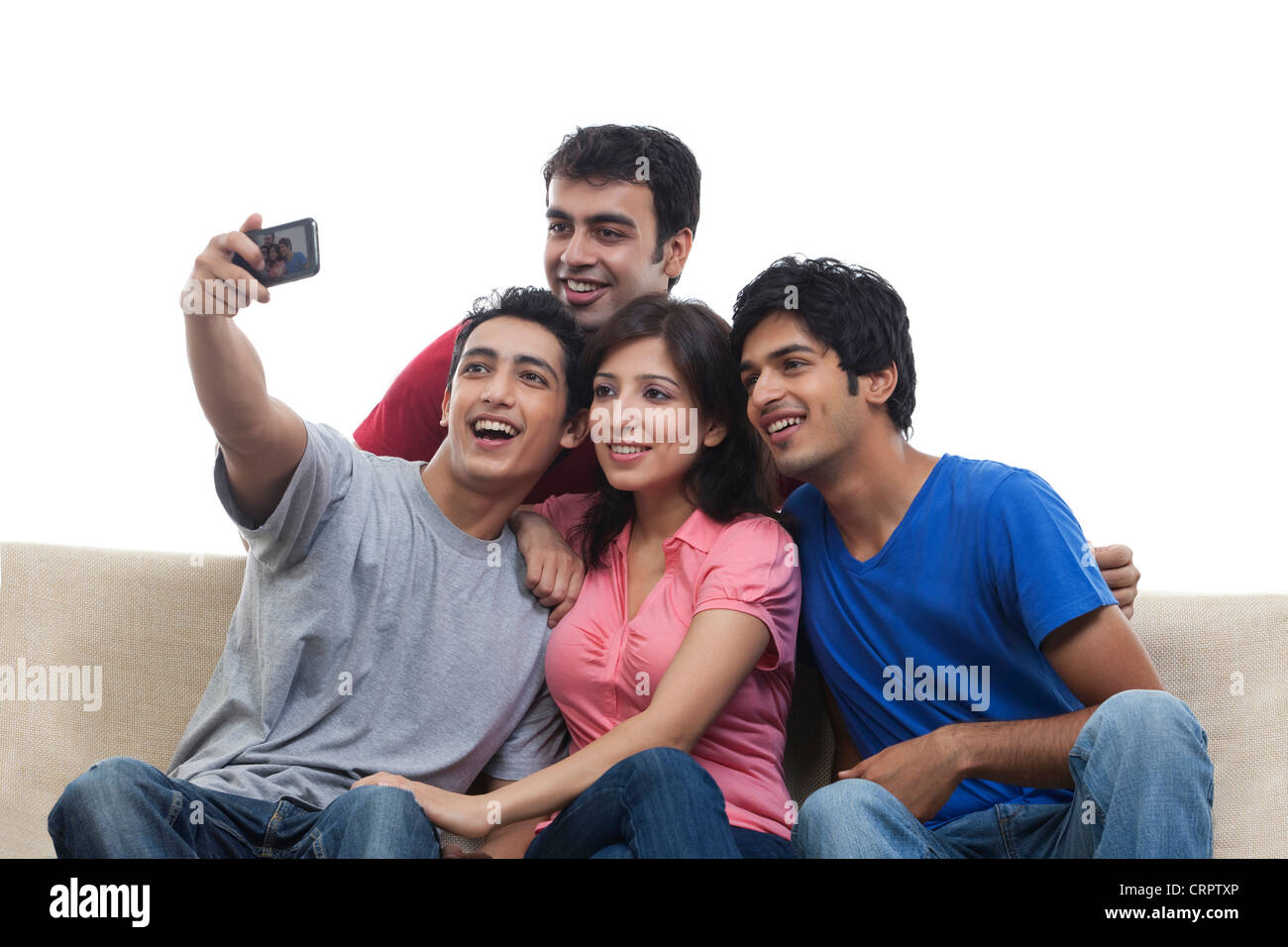Young friends taking self picture over white background Stock Photo - Alamy