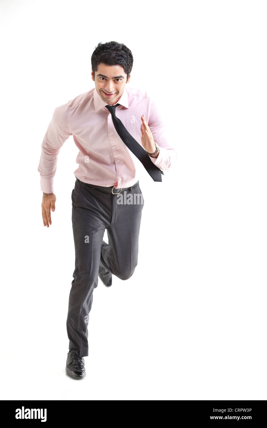 Excited businessman running over white background Stock Photo - Alamy