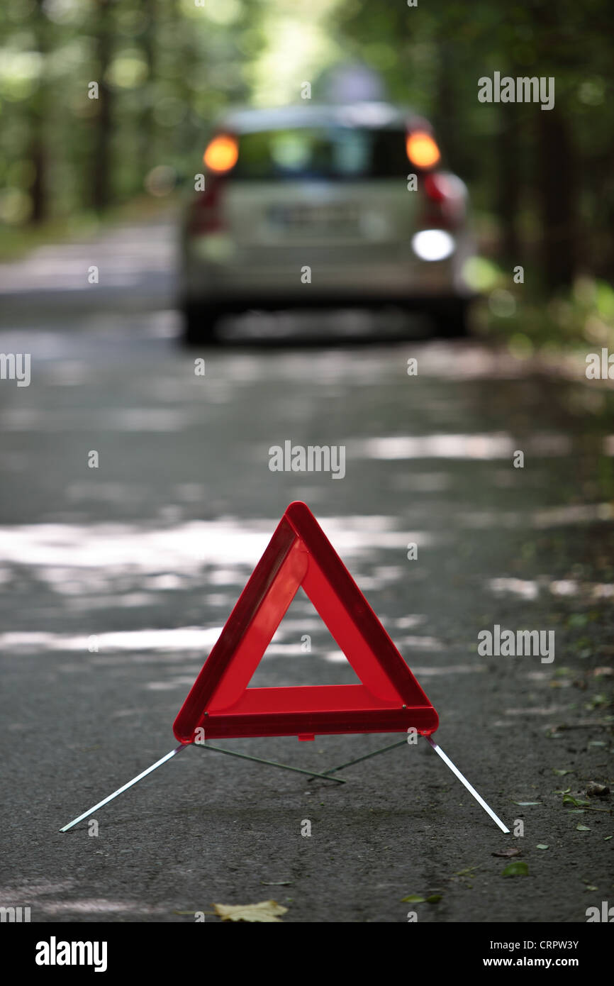 broken down car with warning triangle Stock Photo - Alamy