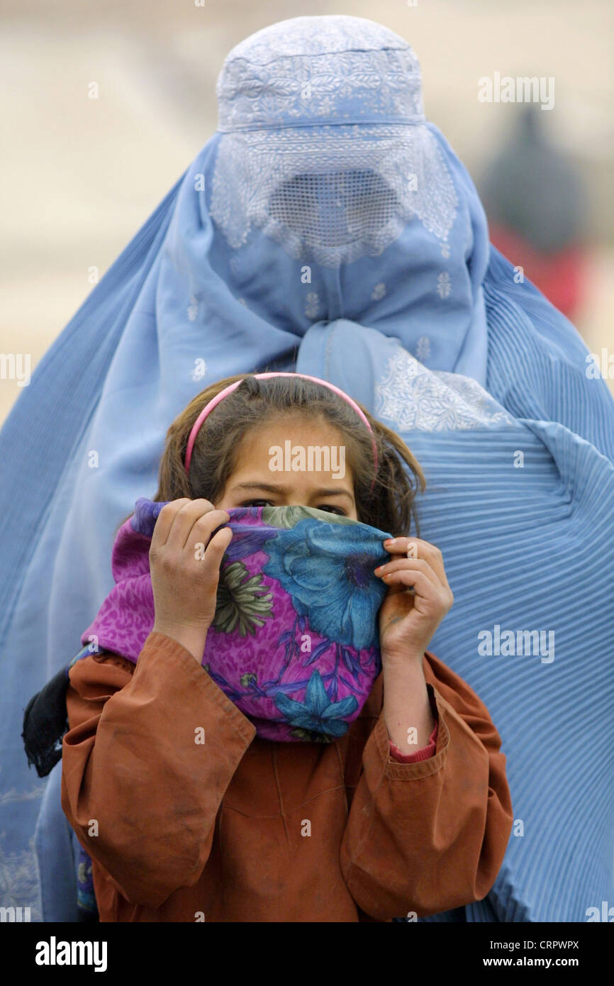 A woman shrouded in a burka with child Stock Photo - Alamy