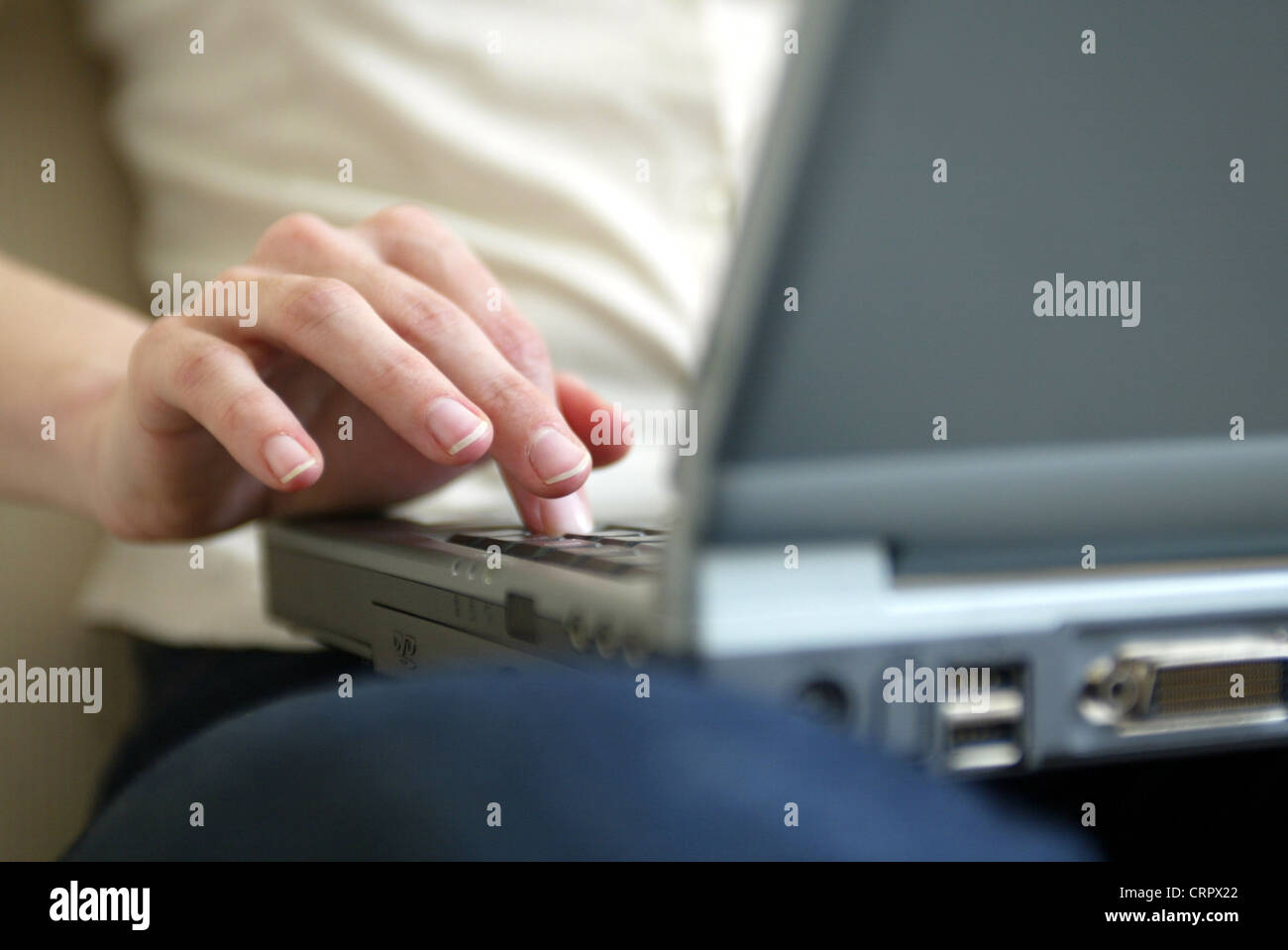Hands of a woman on laptop Stock Photo - Alamy
