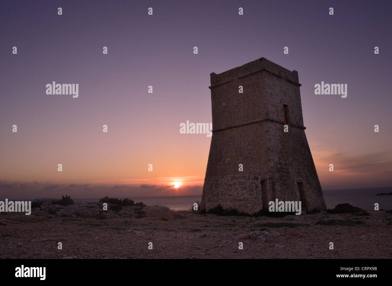 Sunset behind the tower - Malta Stock Photo - Alamy