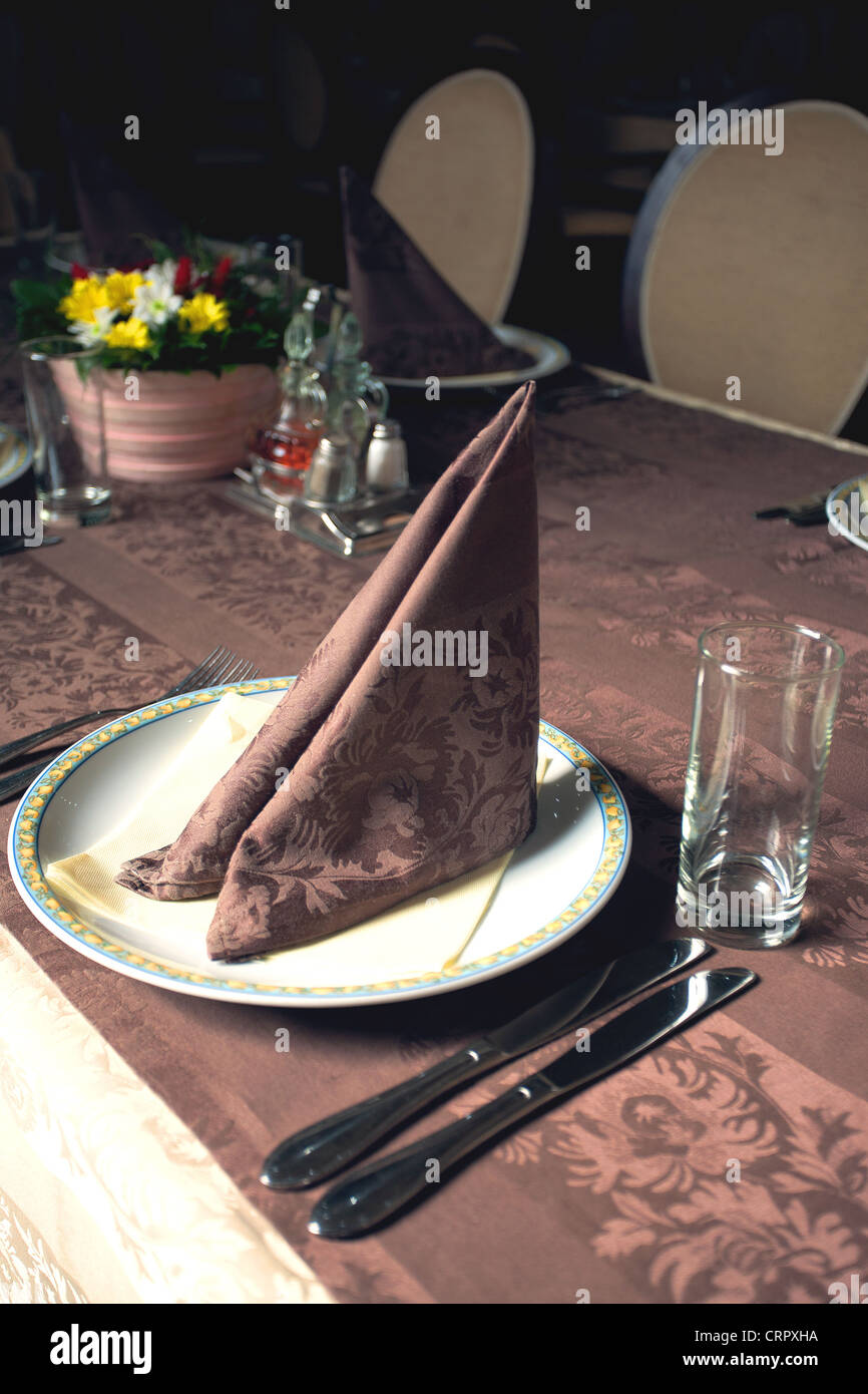 Plate and handkerchief served on a table in a hotel restaurant Stock ...