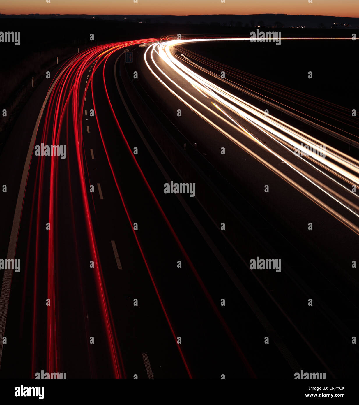 Cars moving fast on a night highway (motion blurred image Stock Photo ...