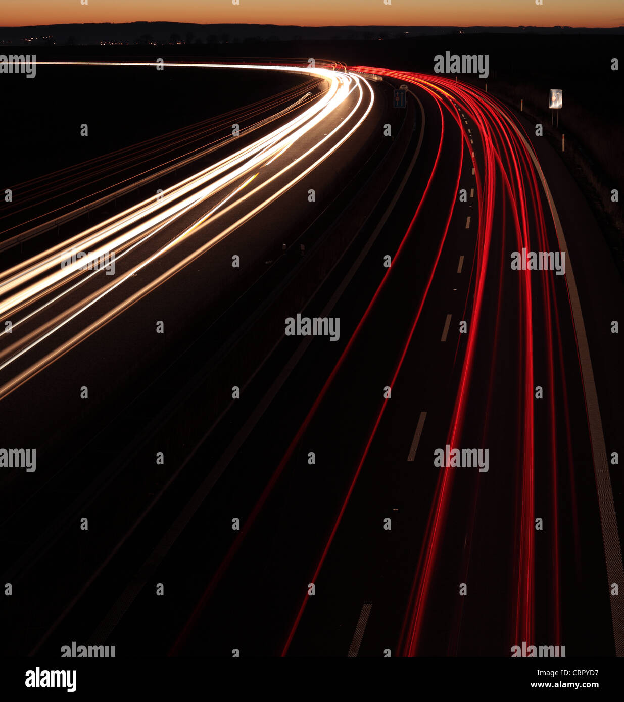 Cars moving fast on a night highway (motion blurred image Stock Photo ...