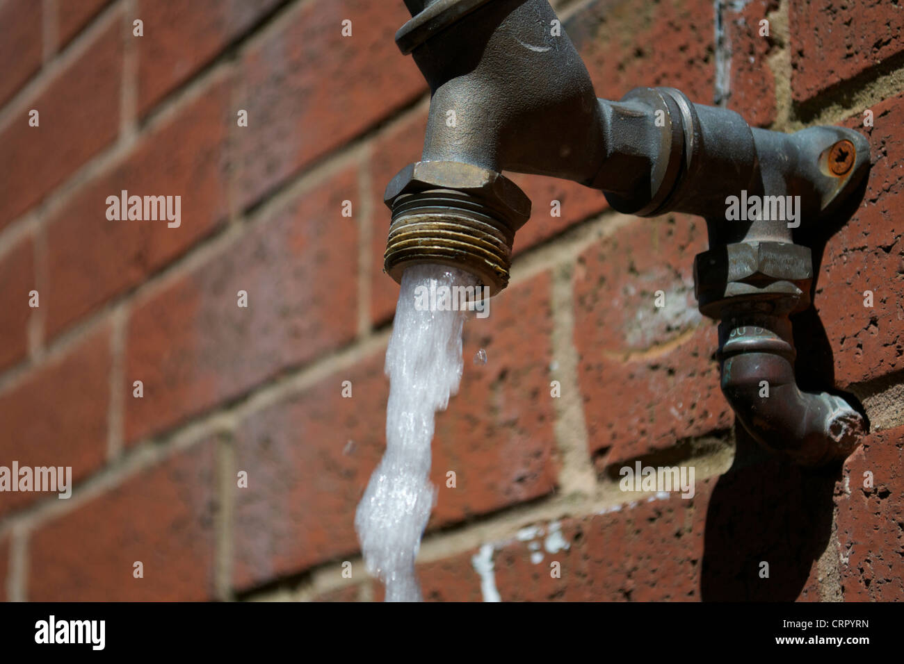 Water gushing from a tap Stock Photo - Alamy