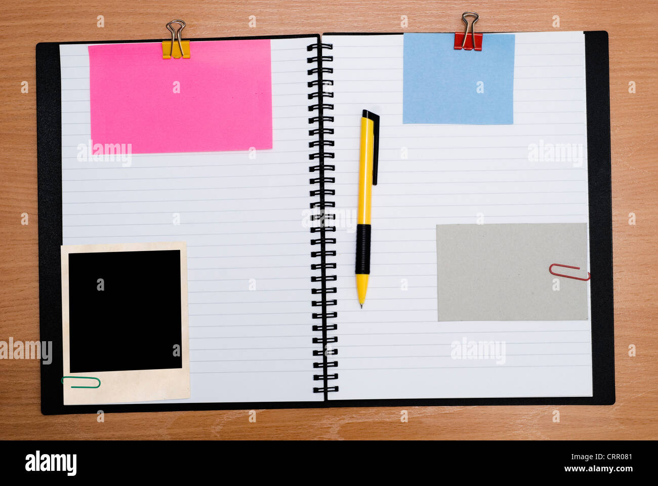 spiral notebook on wood background Stock Photo - Alamy