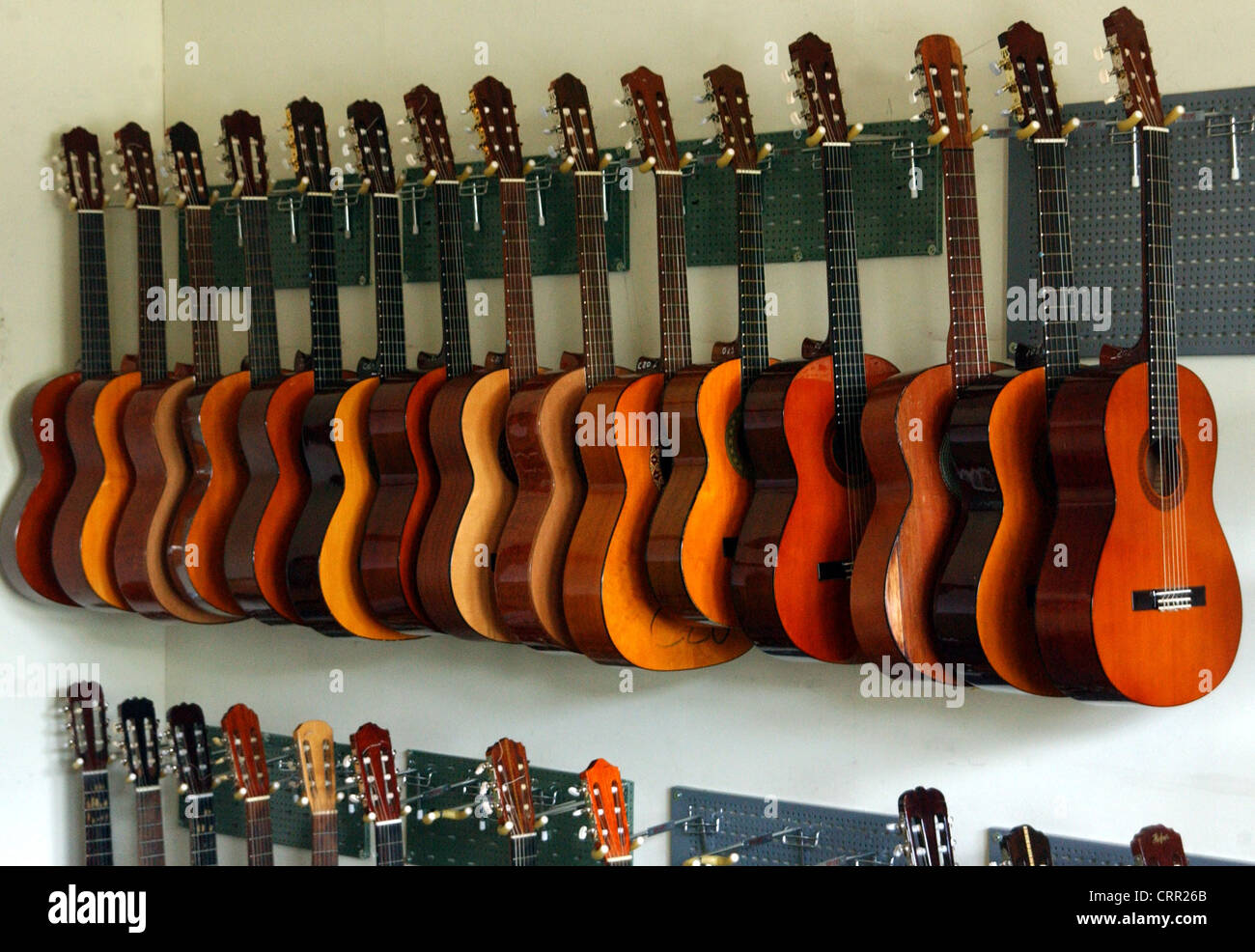 Guitars for music lessons Stock Photo - Alamy