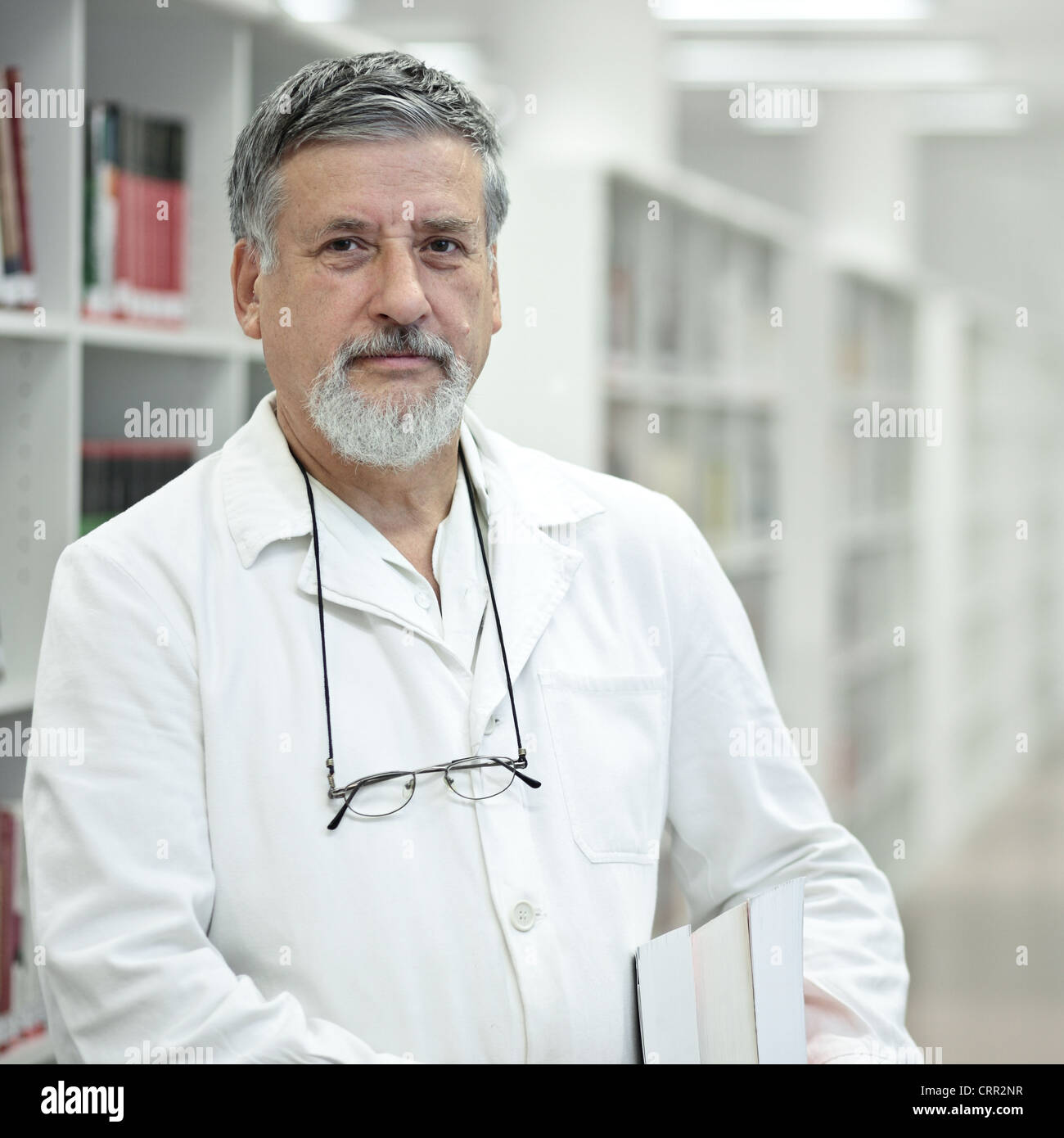 Renowned scientist/doctor in a library of research center/hospital ...
