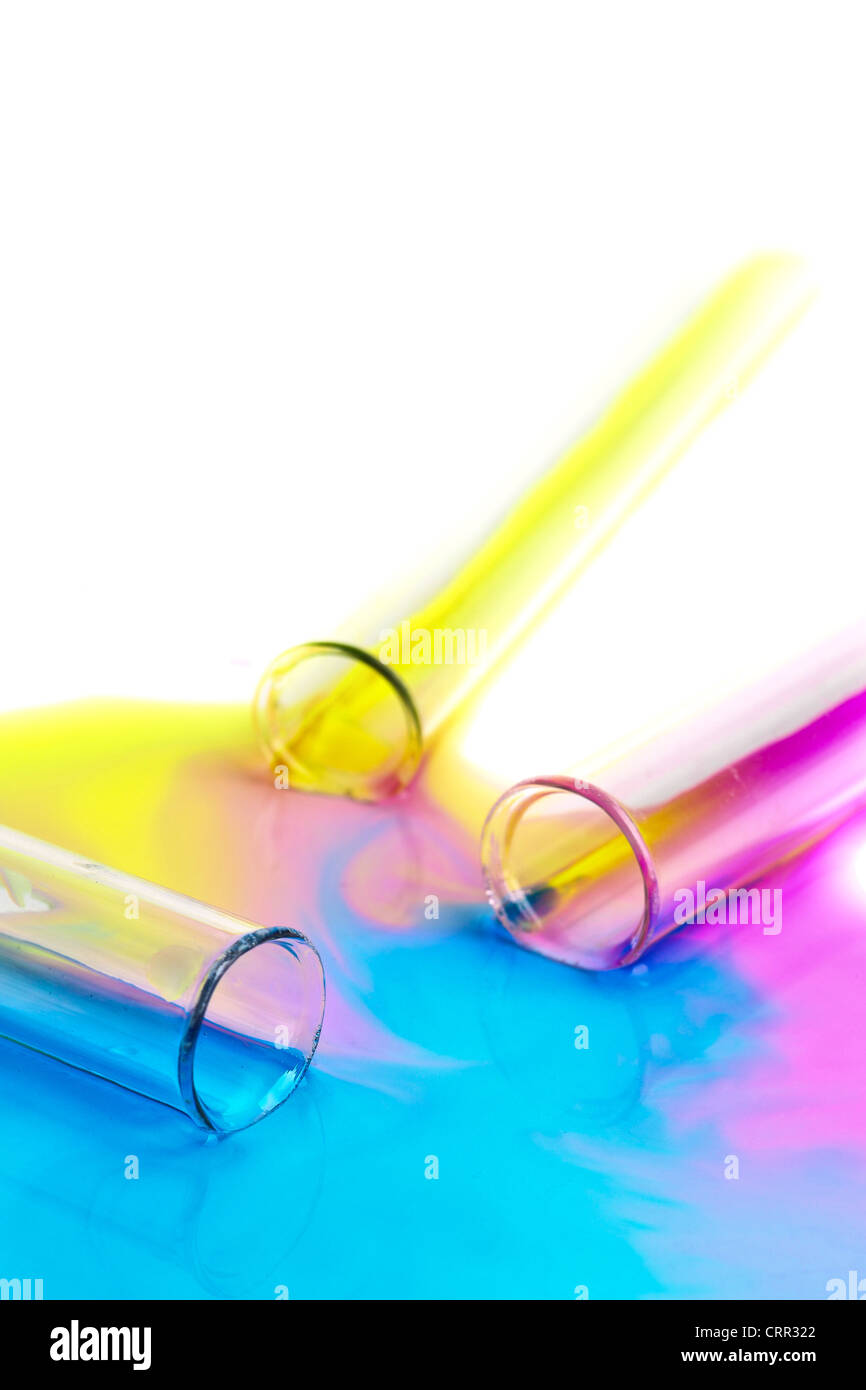 test tubes with colorful substances spilled on a white table in a lab ...