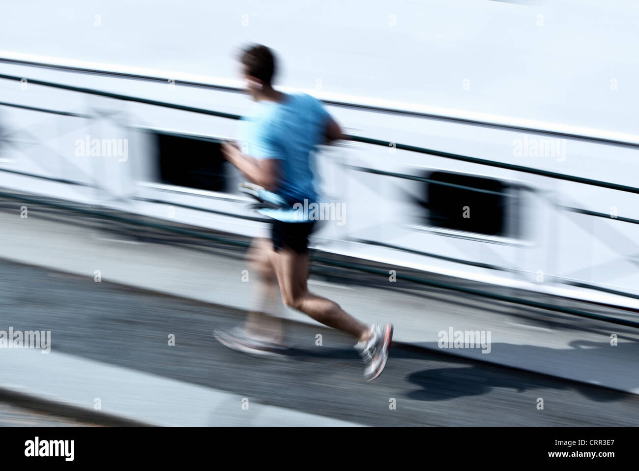 Runner (panning technique used -> motion blurred image Stock Photo - Alamy