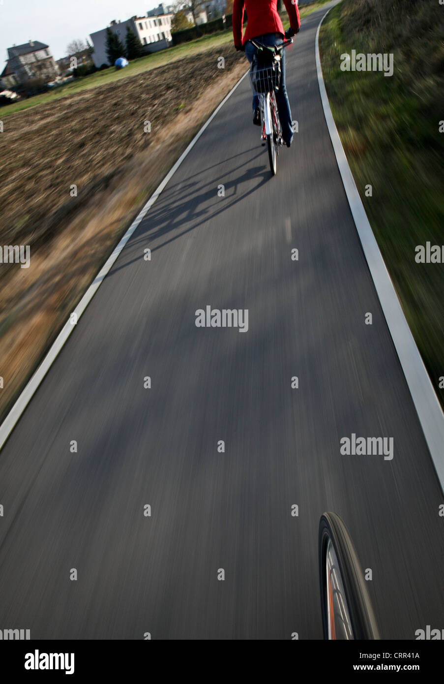 biker on a biking path in a park Stock Photo - Alamy